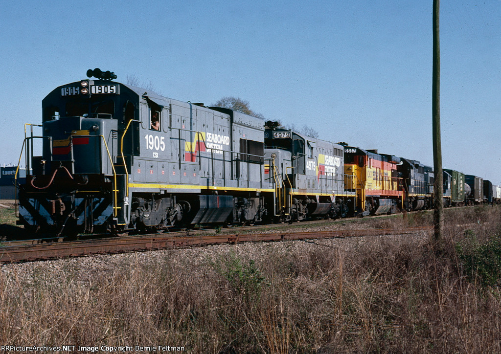 CSX U18B #1905, still in Seaboard System paint, leads Chicago bound train #644 with GP16 #4979 ...
